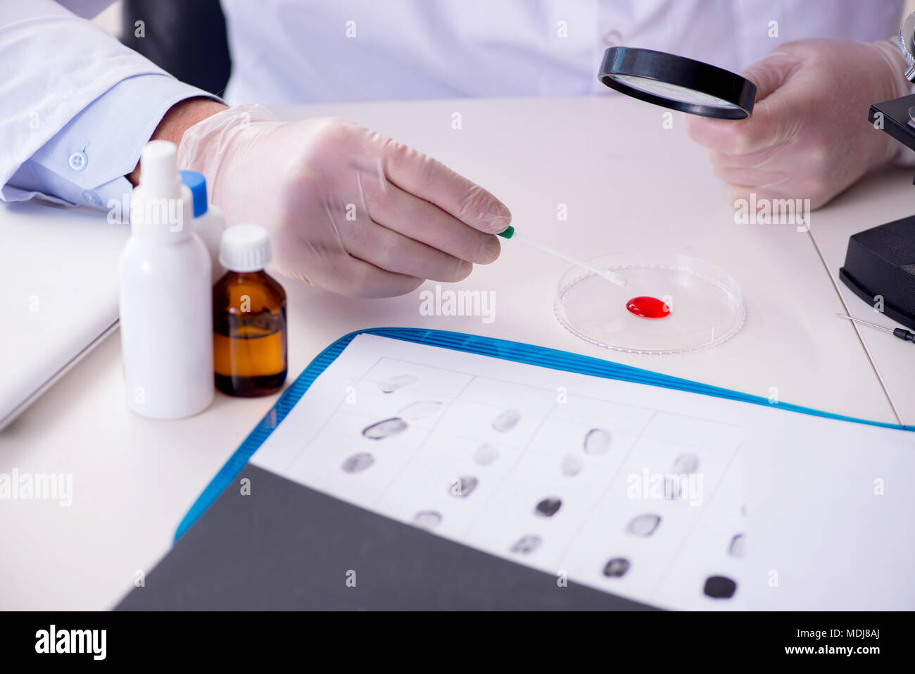 Drug synthesis lab experimentnig with pills Stock Photo - Alamy