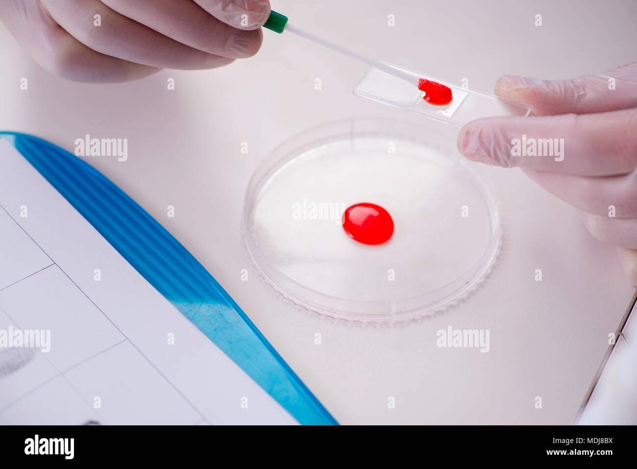 Drug synthesis lab experimentnig with pills Stock Photo - Alamy