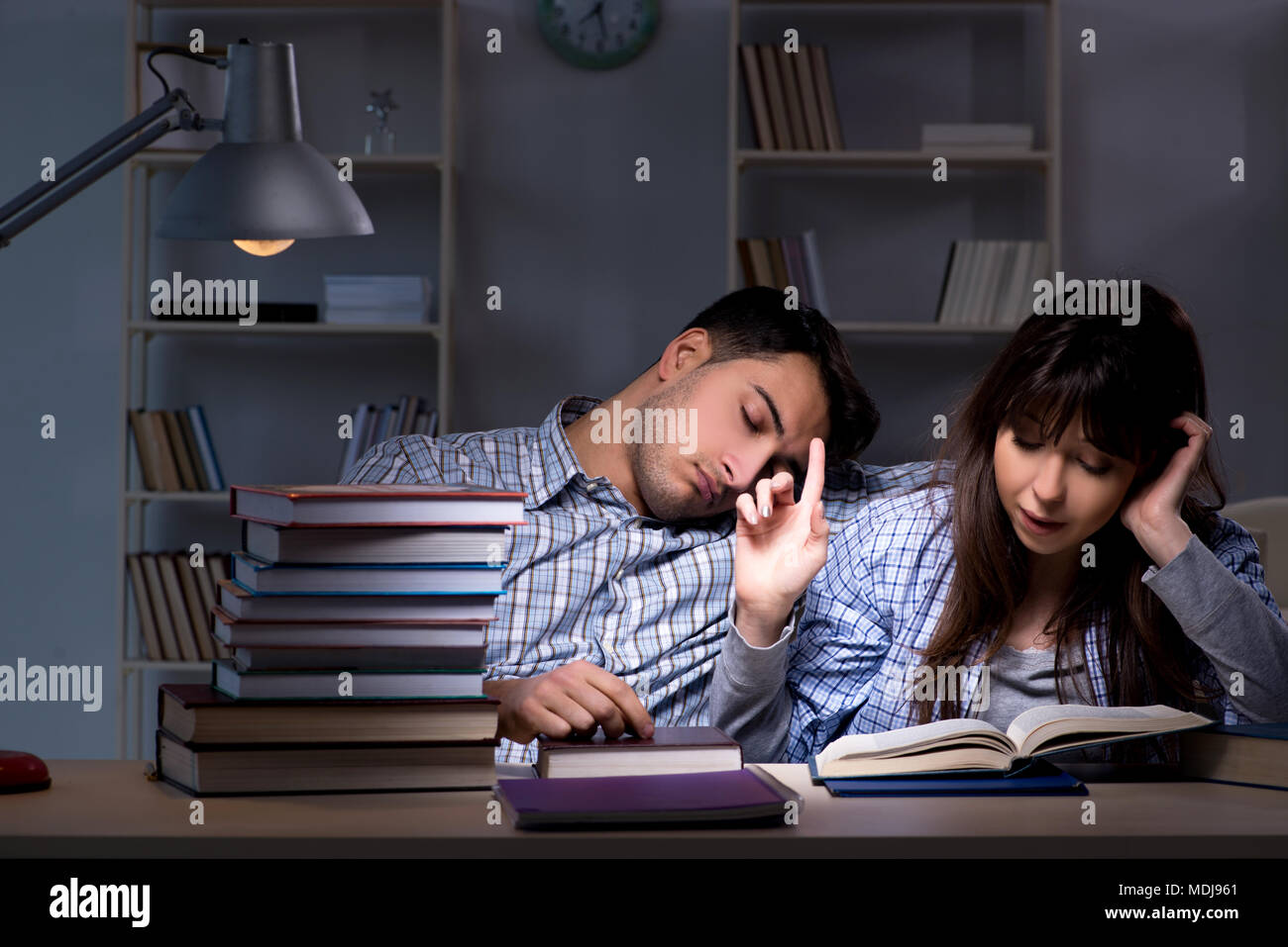 Two students studying late at night Stock Photo - Alamy