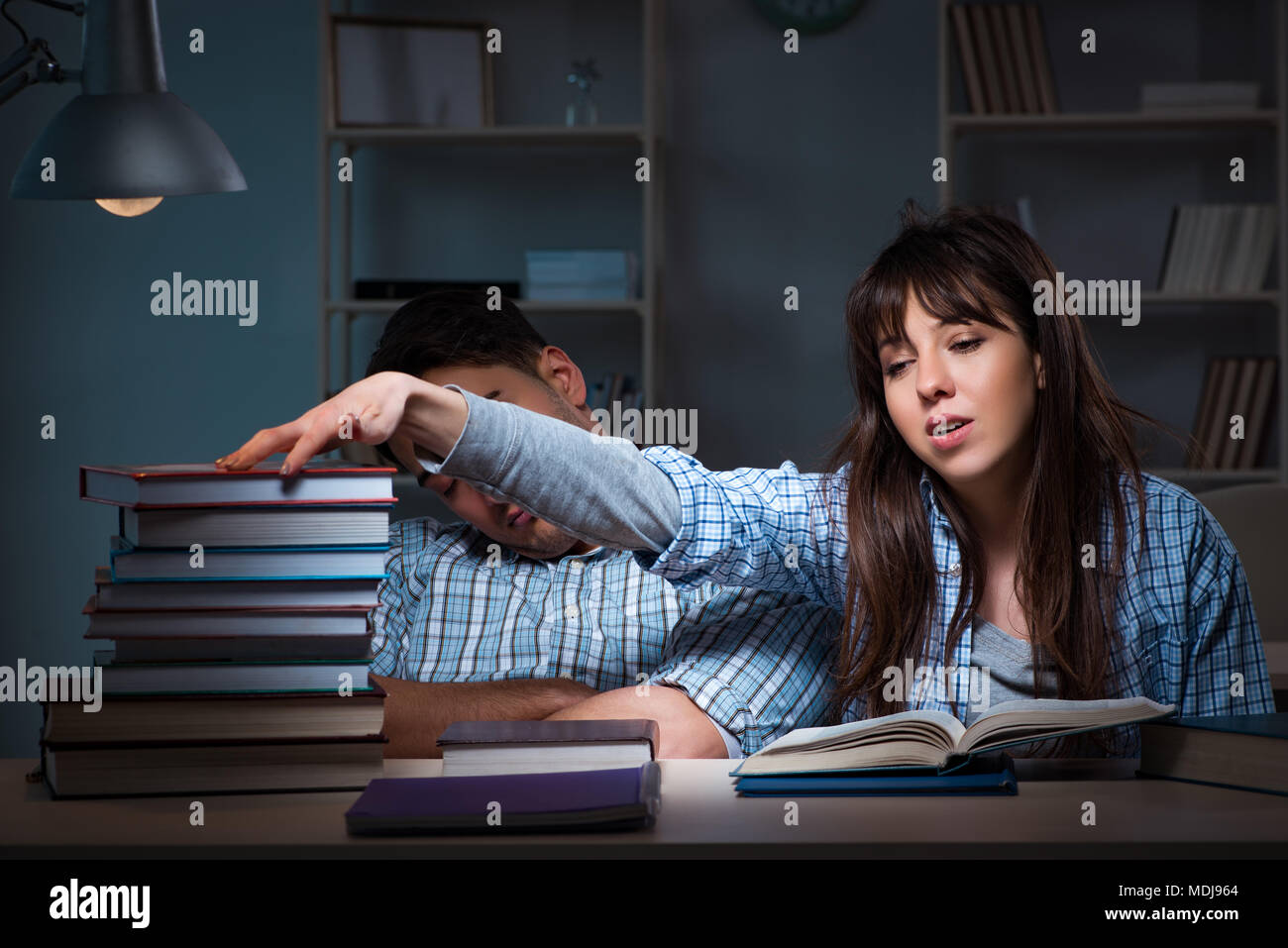 Two students studying late at night Stock Photo - Alamy