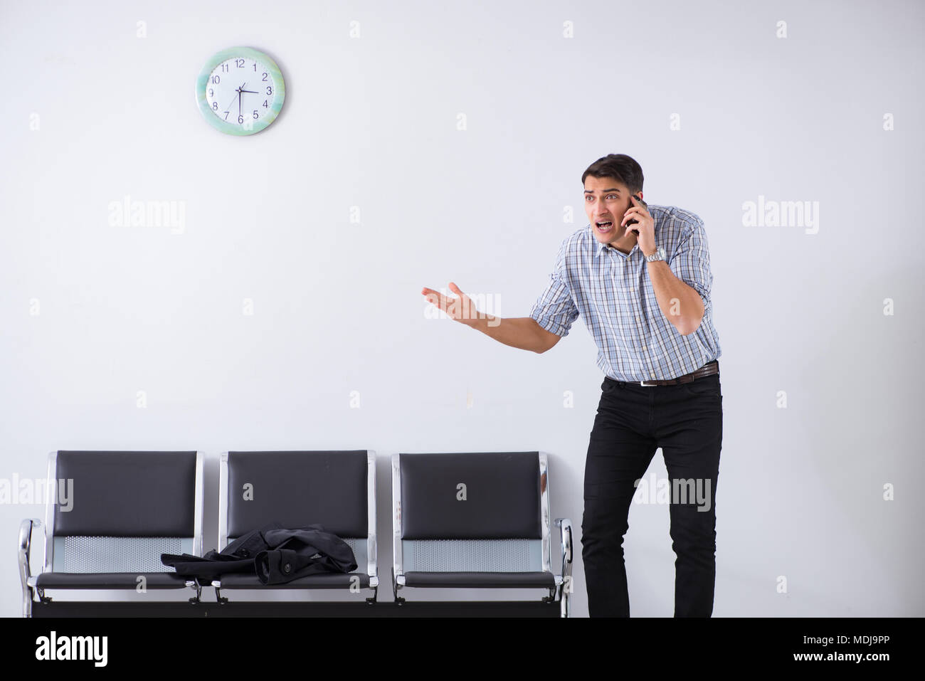 Man nervously impatiently waiting in the lobby Stock Photo - Alamy