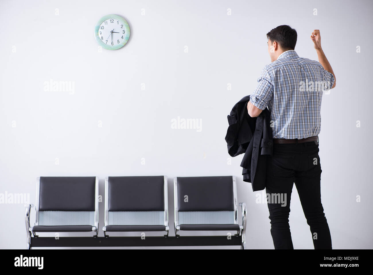 Man nervously impatiently waiting in the lobby Stock Photo - Alamy