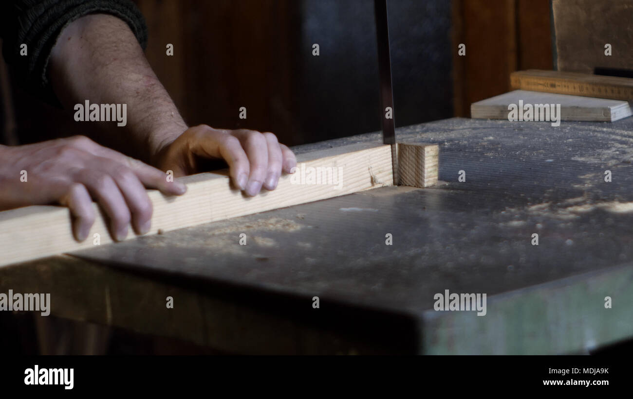 Man cuts piece of wood hi-res stock photography and images - Alamy