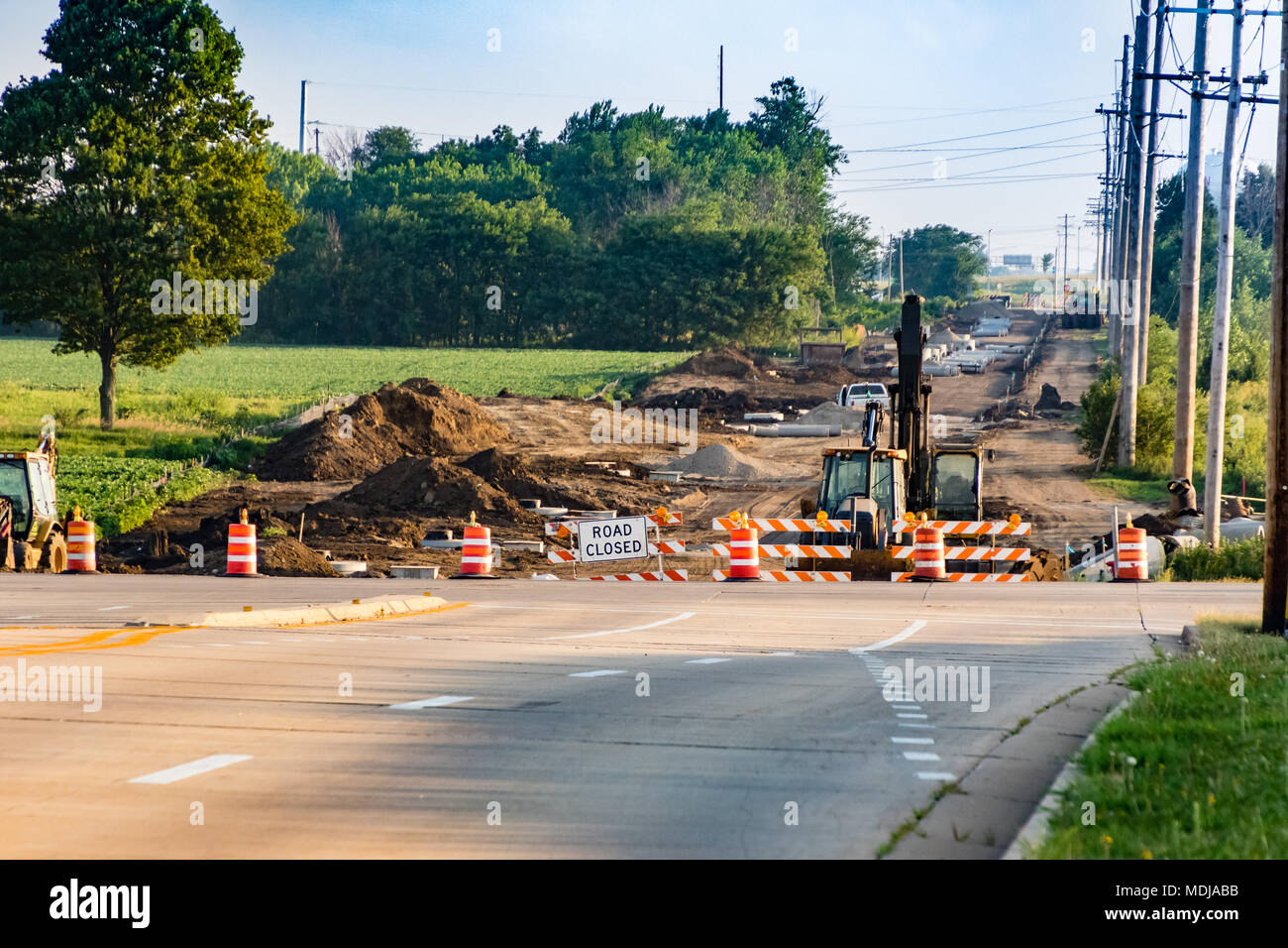 the road work continues on this long closed street Stock Photo - Alamy