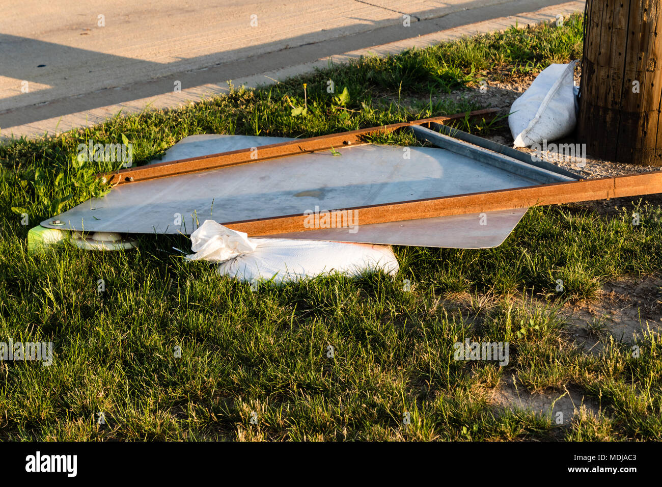 a resting road construction sign by the road sign Stock Photo - Alamy