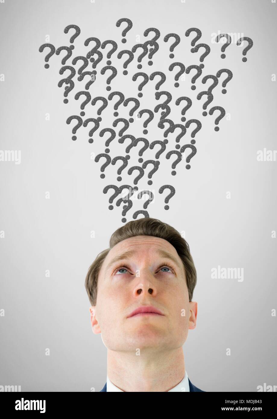 Man with grey question marks emerging from head Stock Photo - Alamy
