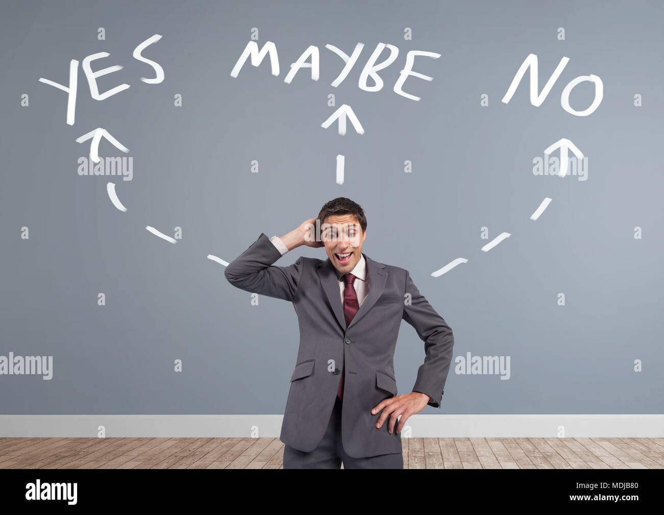 Man thinking Yes No Maybe text with arrows graphic on wall Stock Photo ...