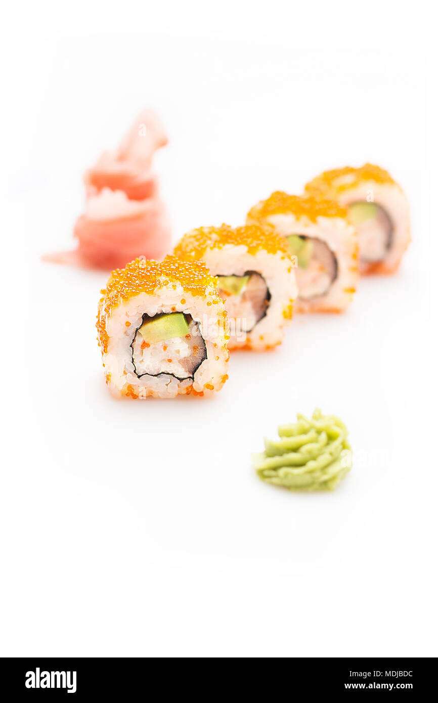 Sushi rolls with avocado shrimp and Philadelphia cheese in flying fish ...