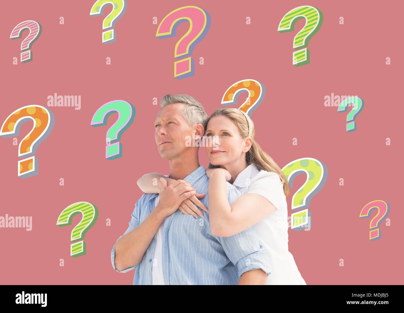 Couple with colorful funky question marks Stock Photo - Alamy