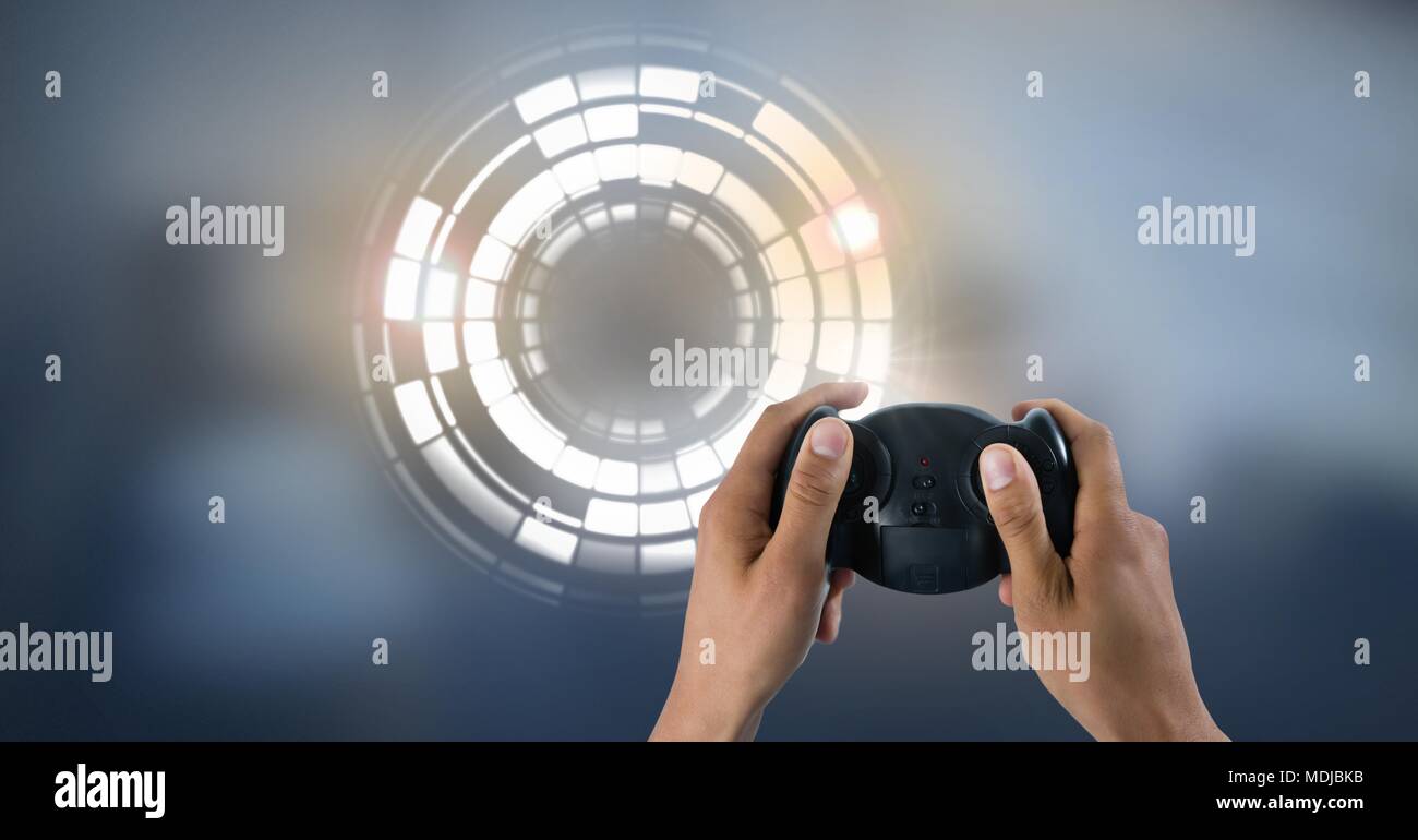 Hands with game controller and Glowing circle technology interface ...
