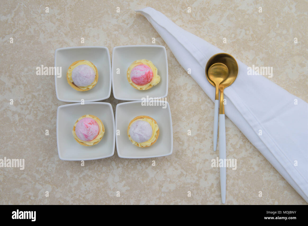 flat lay with mini pastry desserts Stock Photo - Alamy