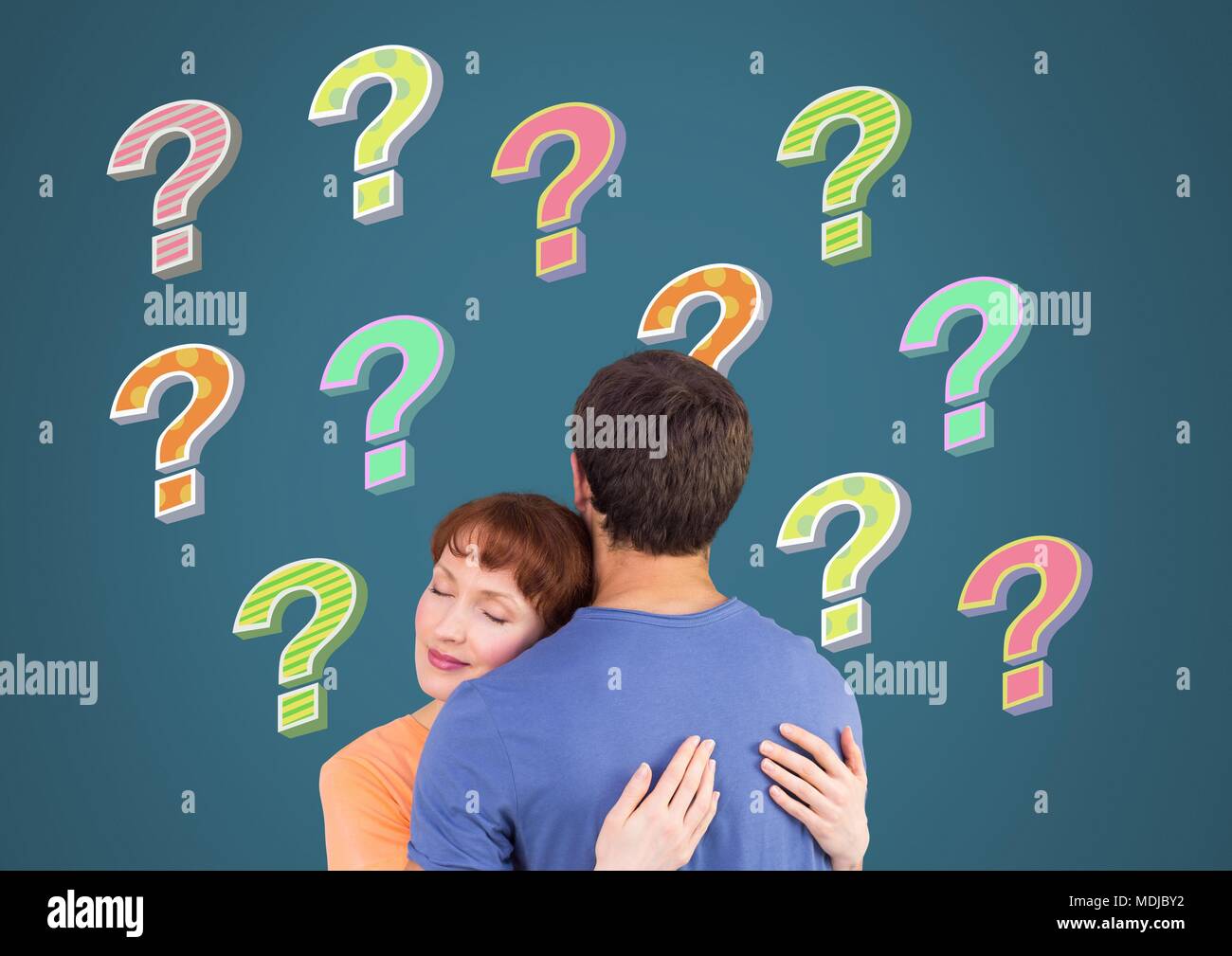 Couple with colorful funky question marks Stock Photo - Alamy