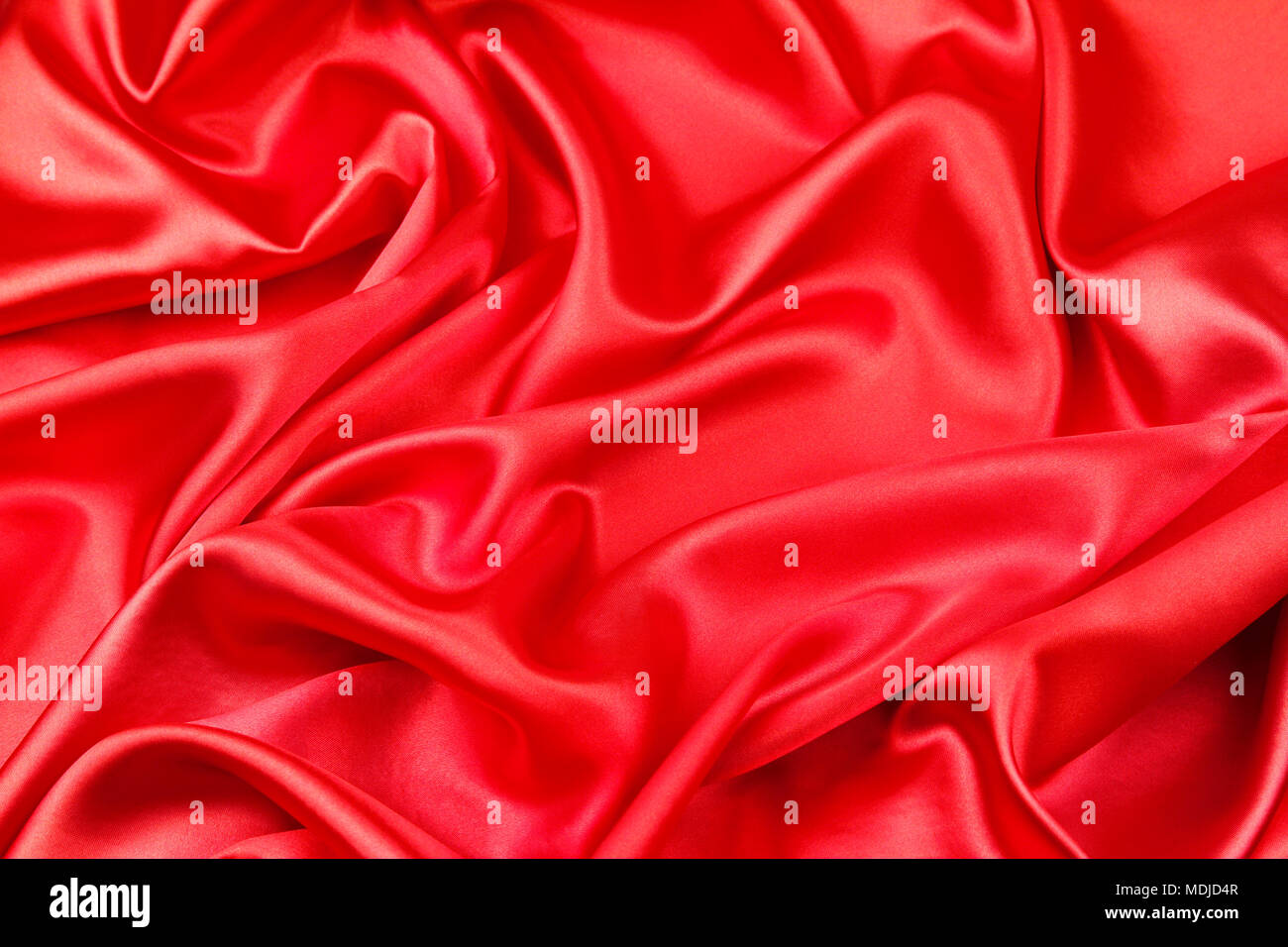 Closeup of ripples in red silk fabric Stock Photo - Alamy