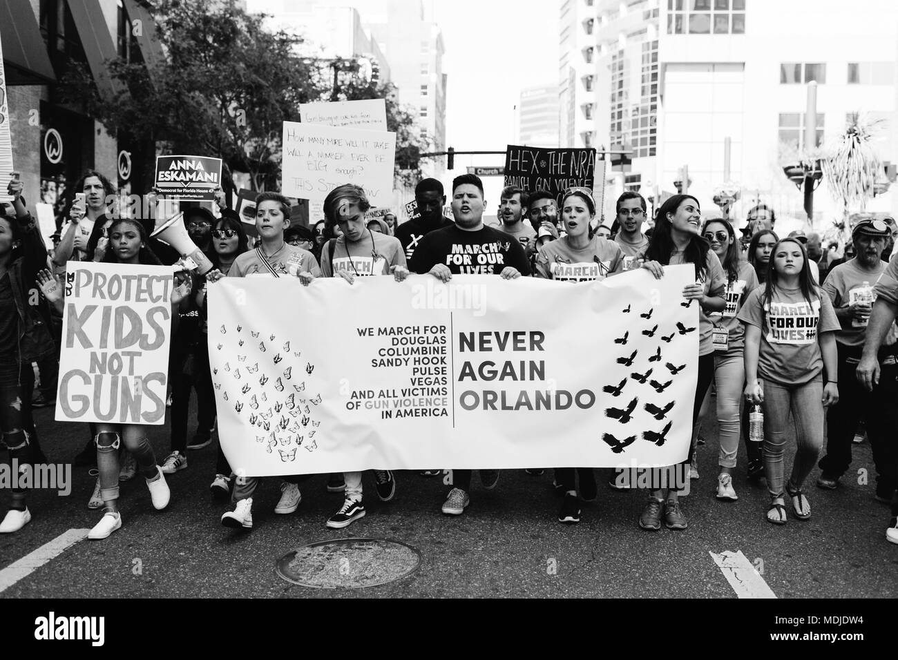 People marching with banner hi-res stock photography and images - Alamy