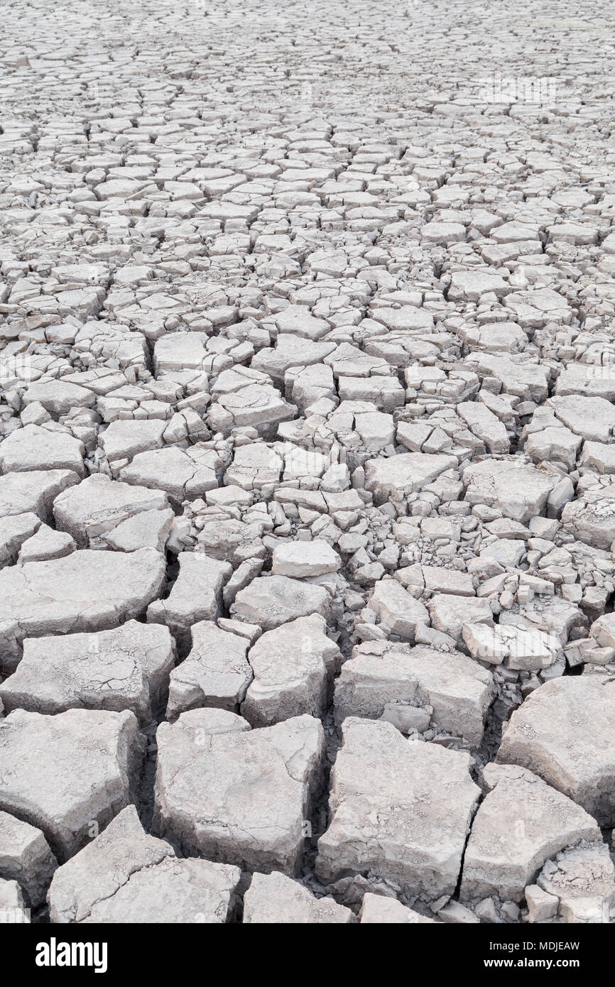 View of cracked and parched gray soil ground after drought Stock Photo ...
