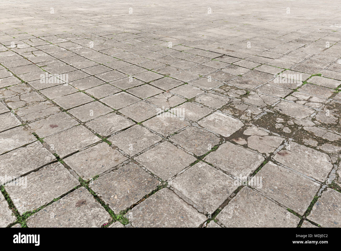 Full frame background of old and weathered cement paving slabs outdoors ...
