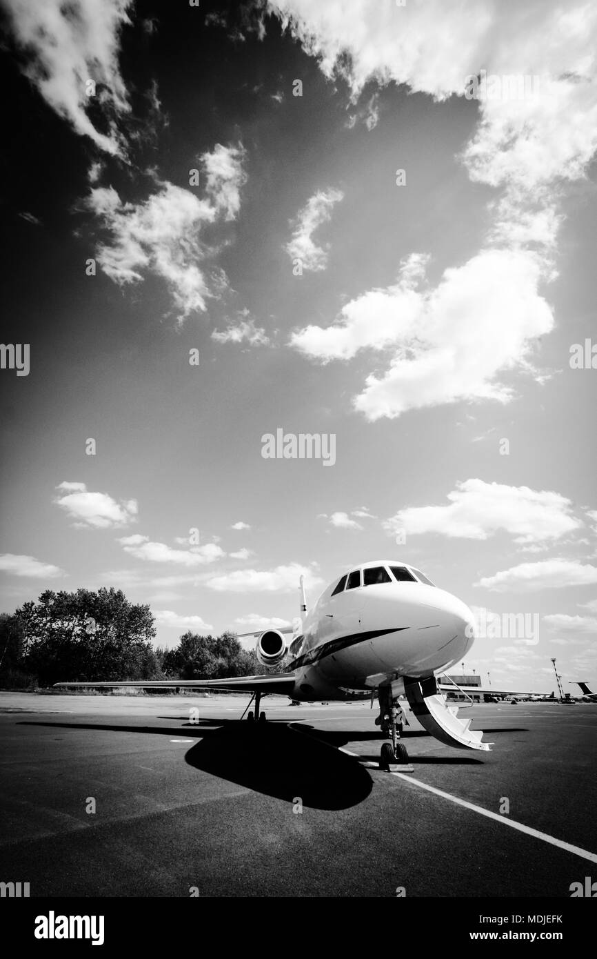 Falcon 2000 business jet is waiting for passengers and ready to go ...