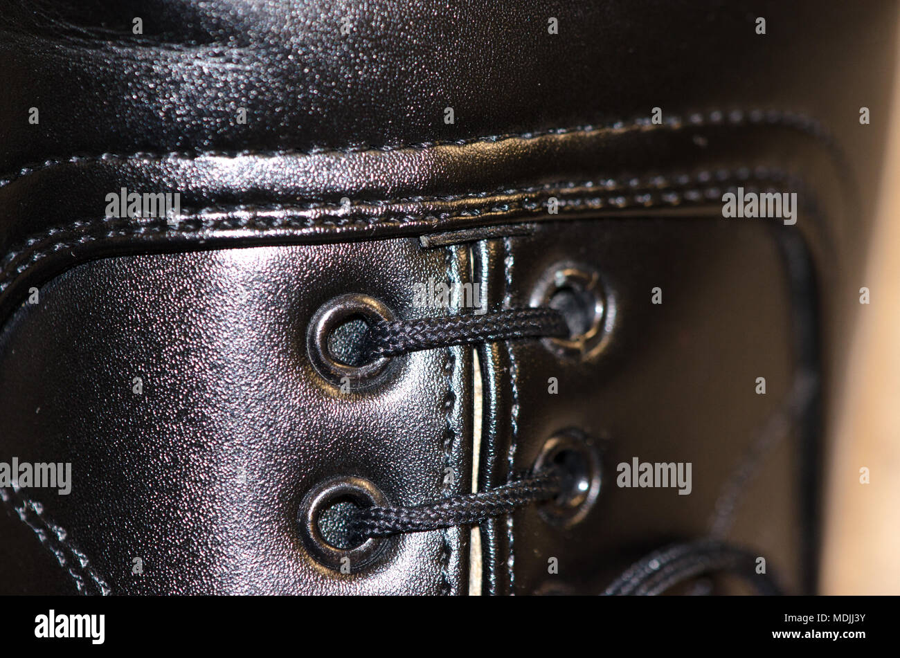 Upper part of black shoe Stock Photo - Alamy