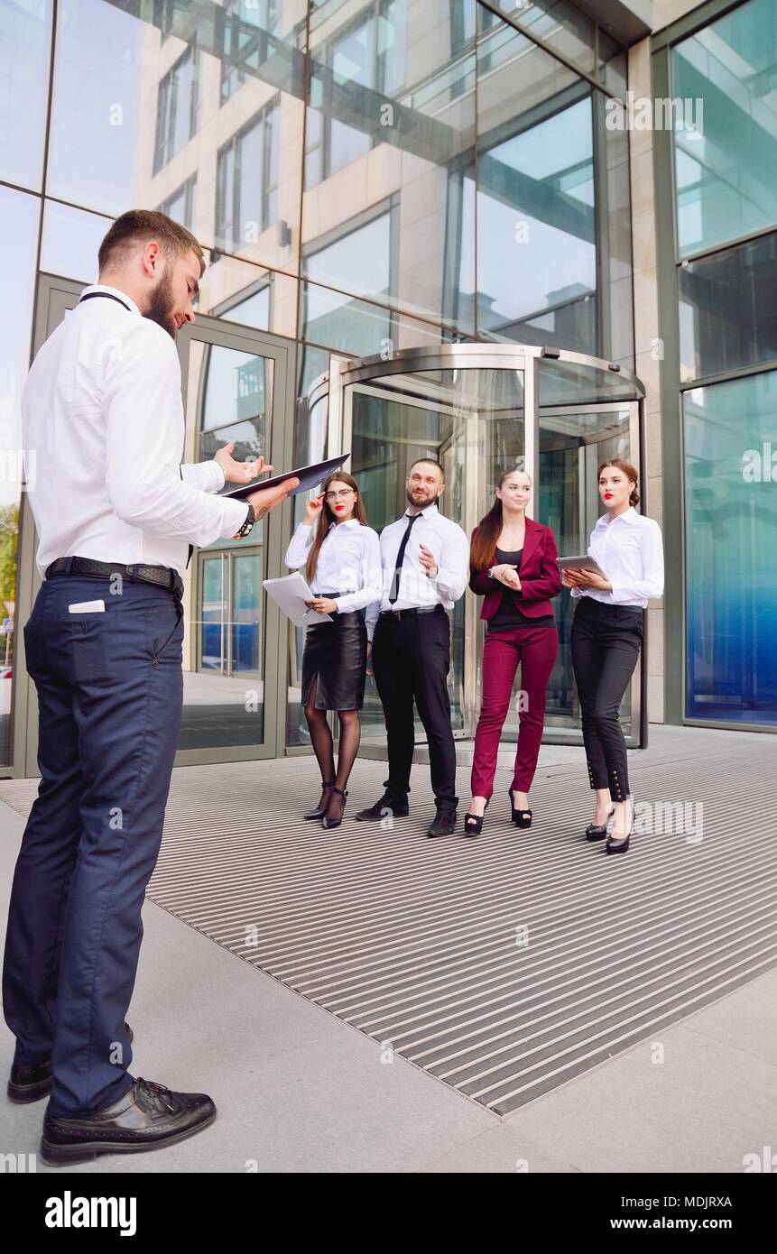Meeting. Teamwork. The chief talks with the office staff against the ...