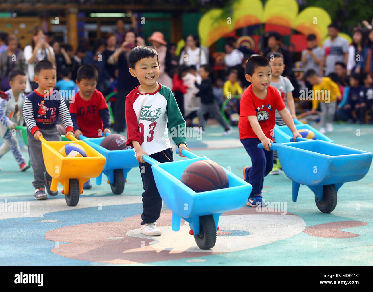 Tianjin, China. 19th Apr, 2018. Children take part in sports games at ...
