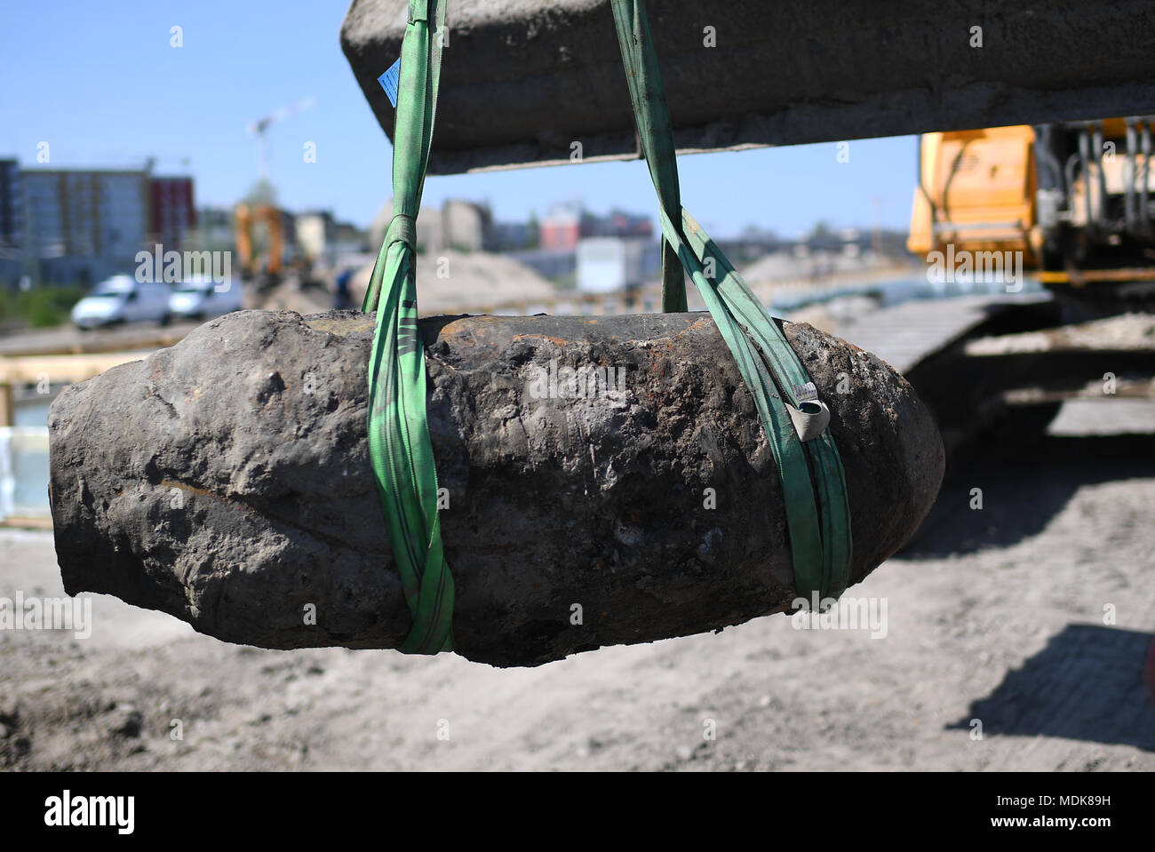 20 April 2018, Germany, Berlin: A crane lifts a defused WWII bomb from ...