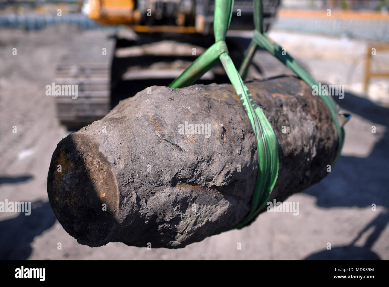 20 April 2018, Germany, Berlin: A crane lifts a defused WWII bomb from ...