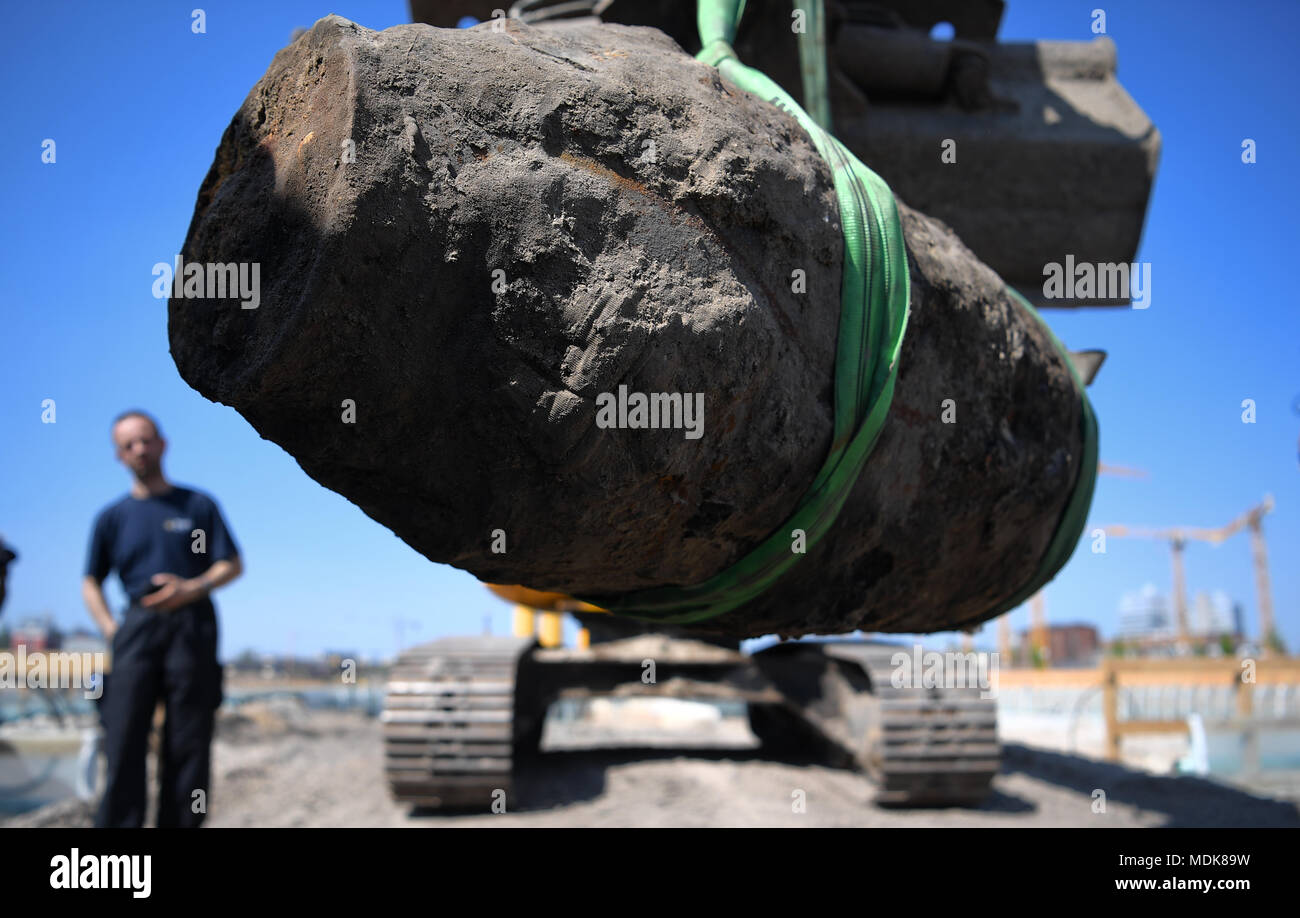 20 April 2018, Germany, Berlin: A crane lifts a defused WWII bomb from ...