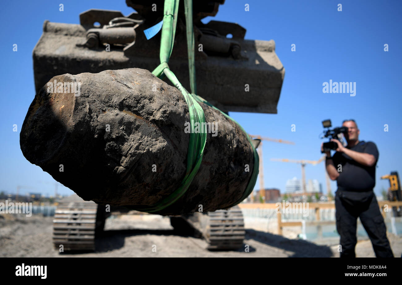 20 April 2018, Germany, Berlin: A crane lifts a defused WWII bomb from ...