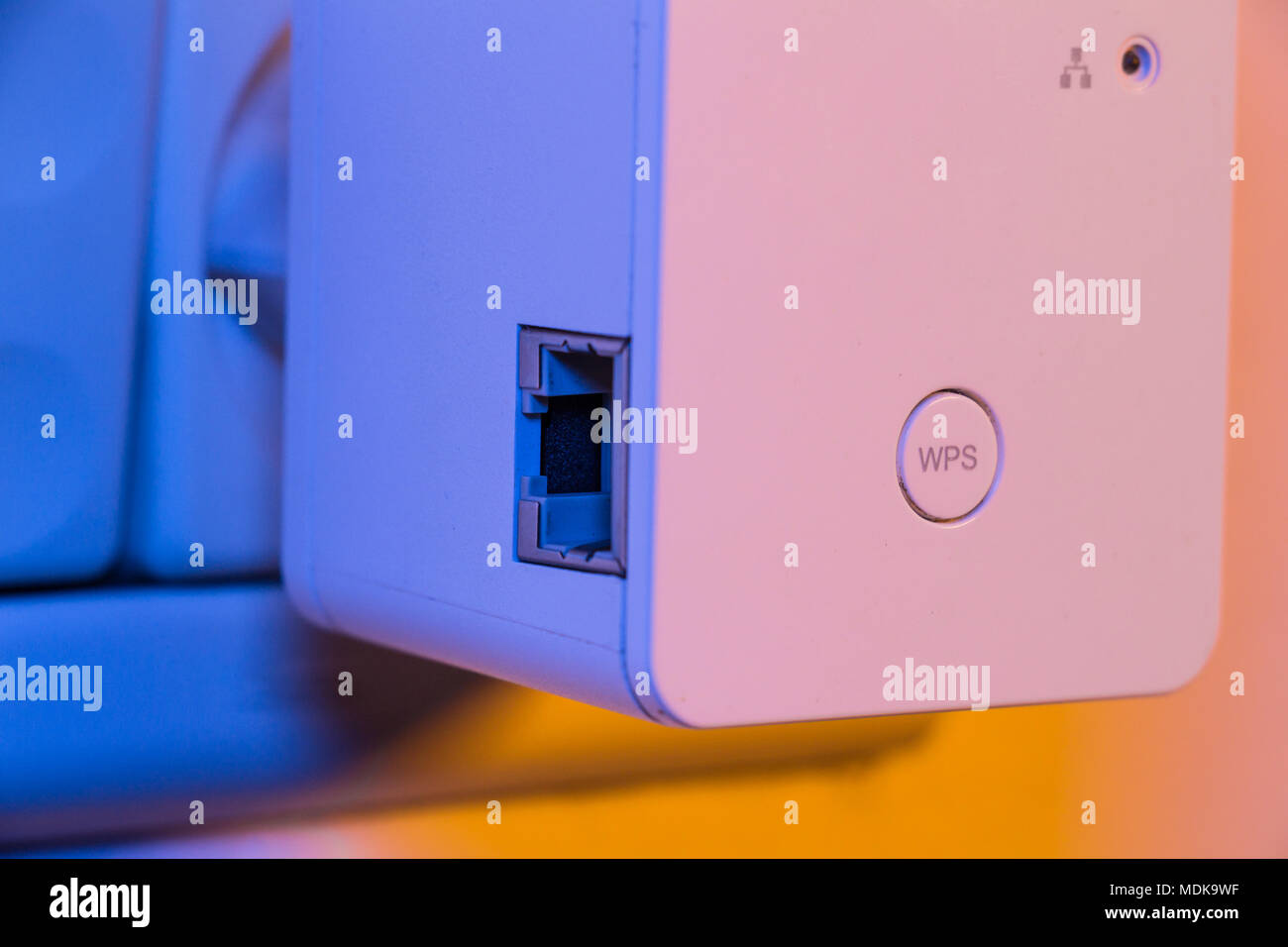 WiFi repeater in electrical socket on the wall. Device that help to ...