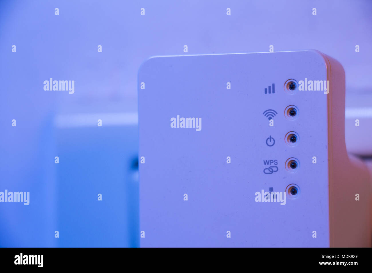 Closeup on WiFi repeater signal connection status led lights. The ...