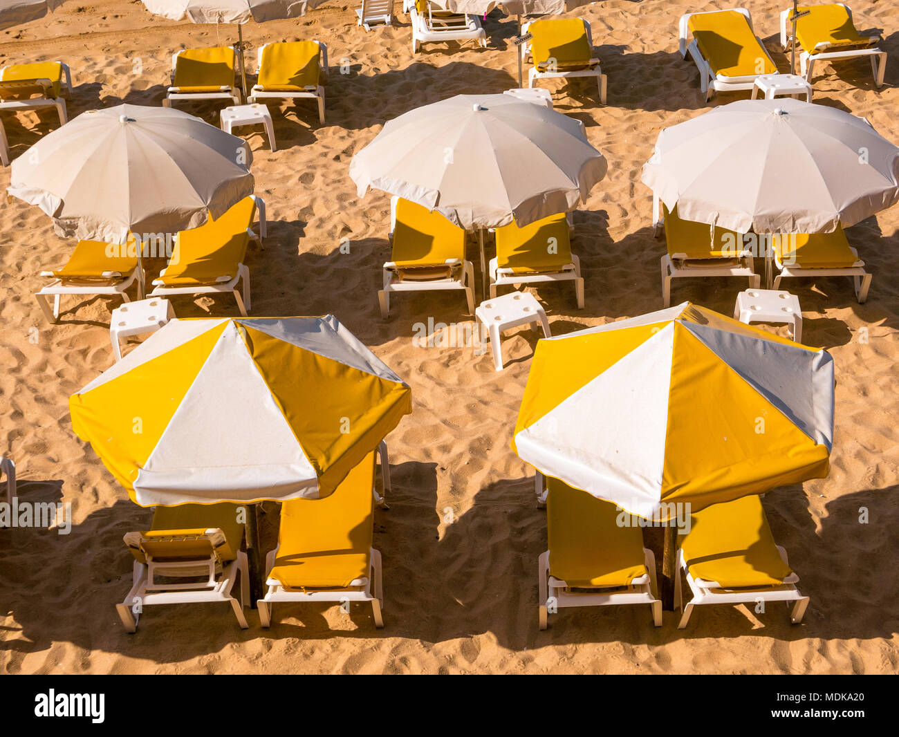 Yellow umbrellas on the beach Stock Photo - Alamy