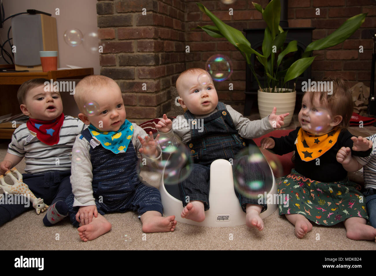 Babies playing with bubbles aged 6 & 7 Months Stock Photo - Alamy
