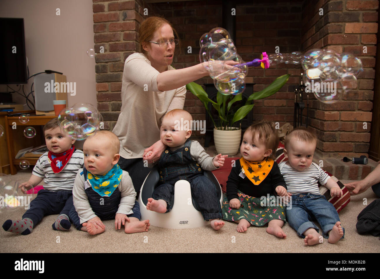 Babies playing with bubbles aged 6 & 7 Months Stock Photo - Alamy