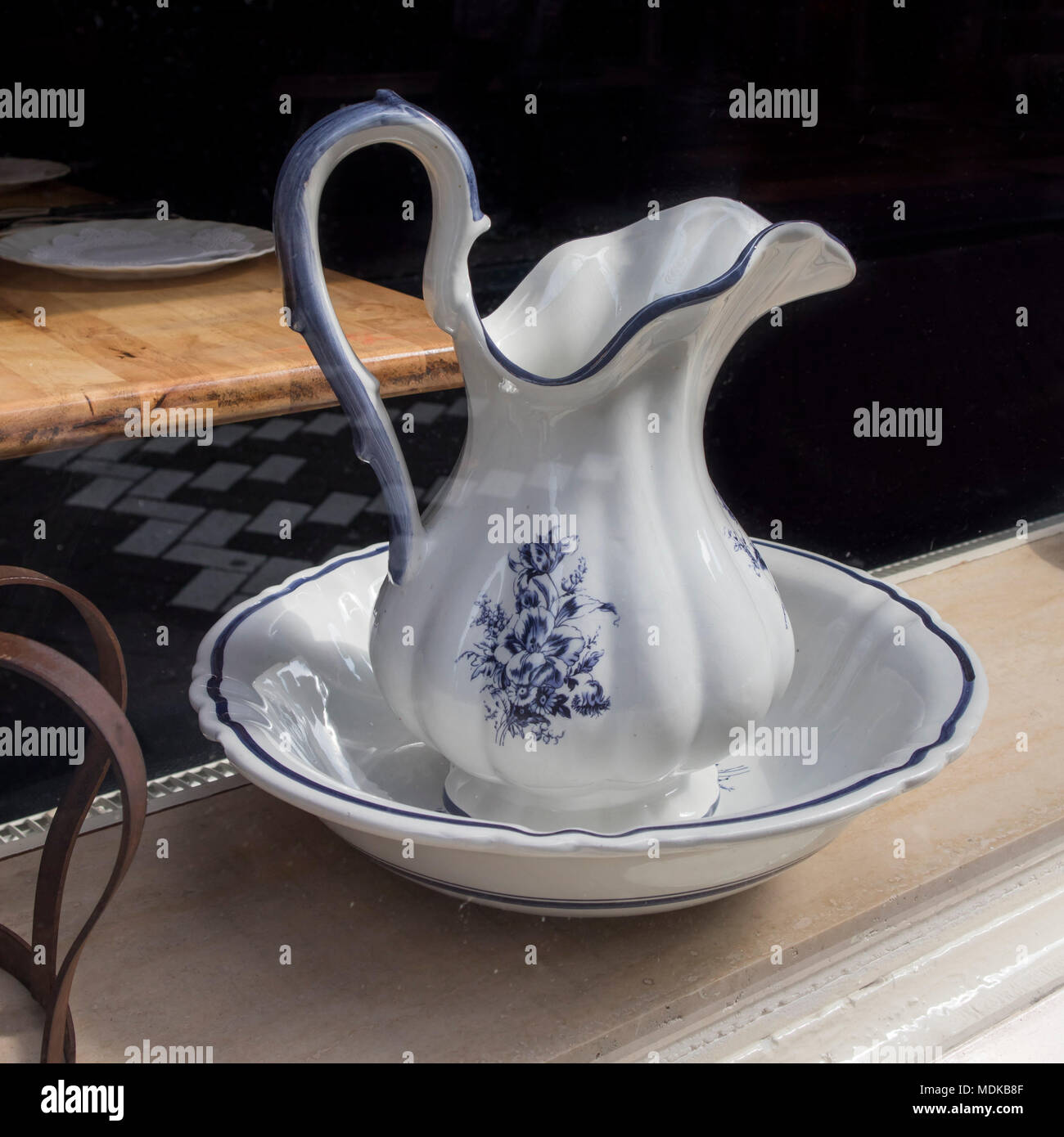 A traditional vintage white with a blue Dutch jug with blue painted ...