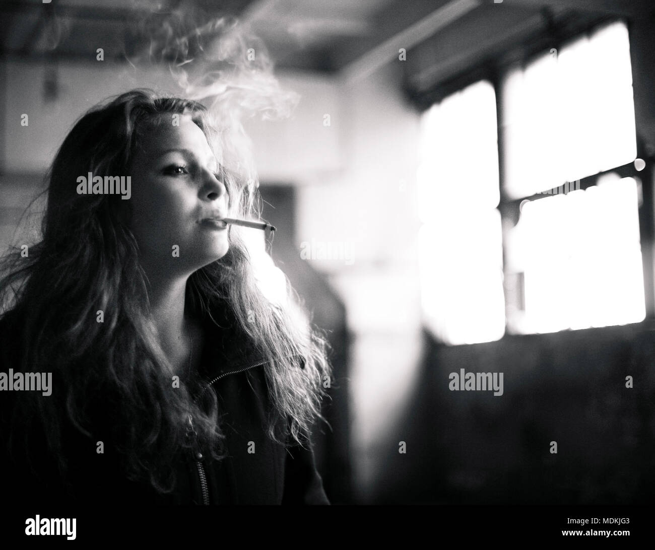 Crying woman with cigarette hi-res stock photography and images - Alamy