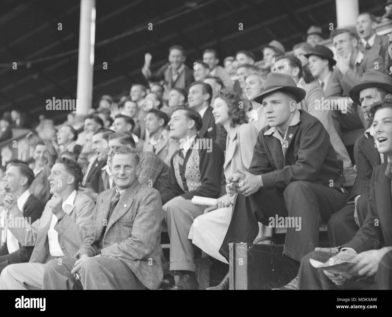 Crowd watching AFL game in Brisbane, 1947 Stock Photo - Alamy