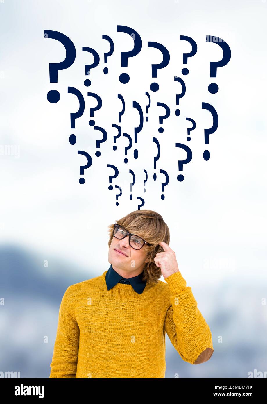 Man thinking with question marks Stock Photo - Alamy