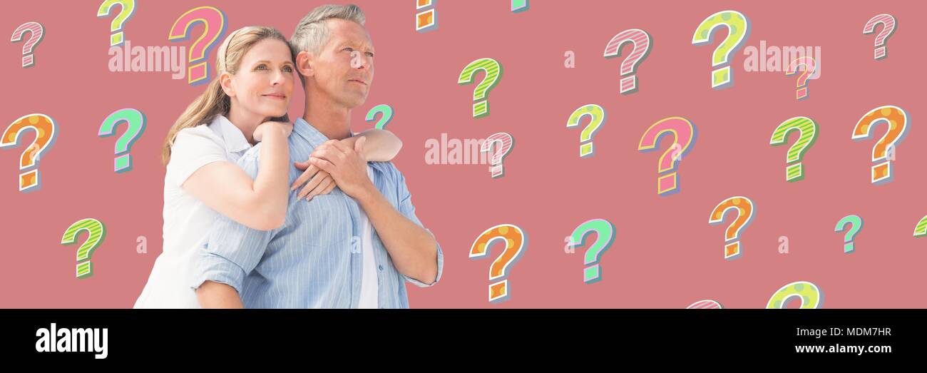 Couple with colorful funky question marks Stock Photo - Alamy