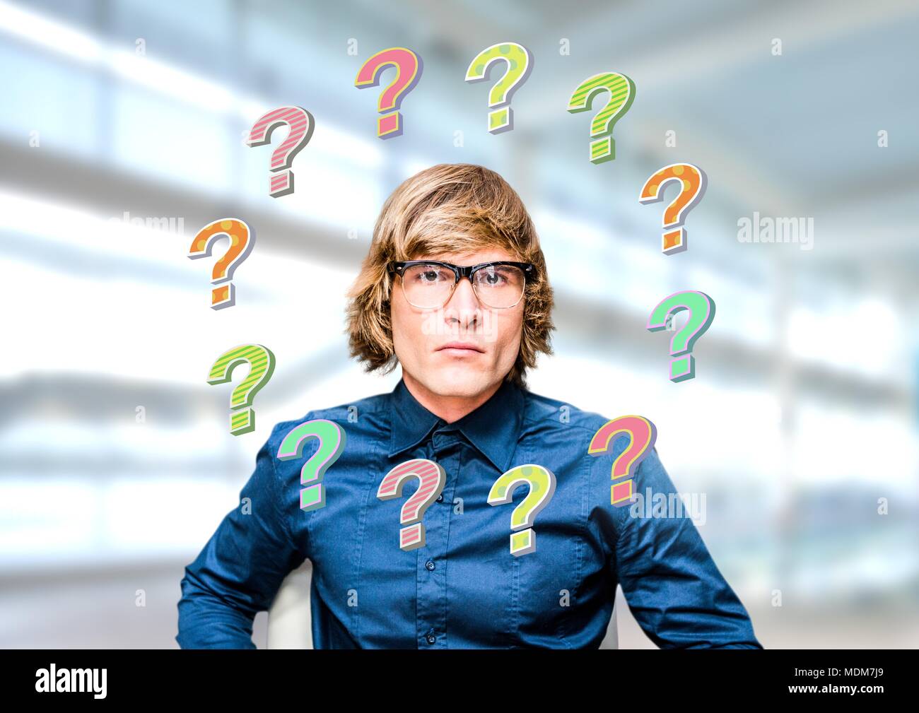 Man thinking with circle of question marks Stock Photo - Alamy