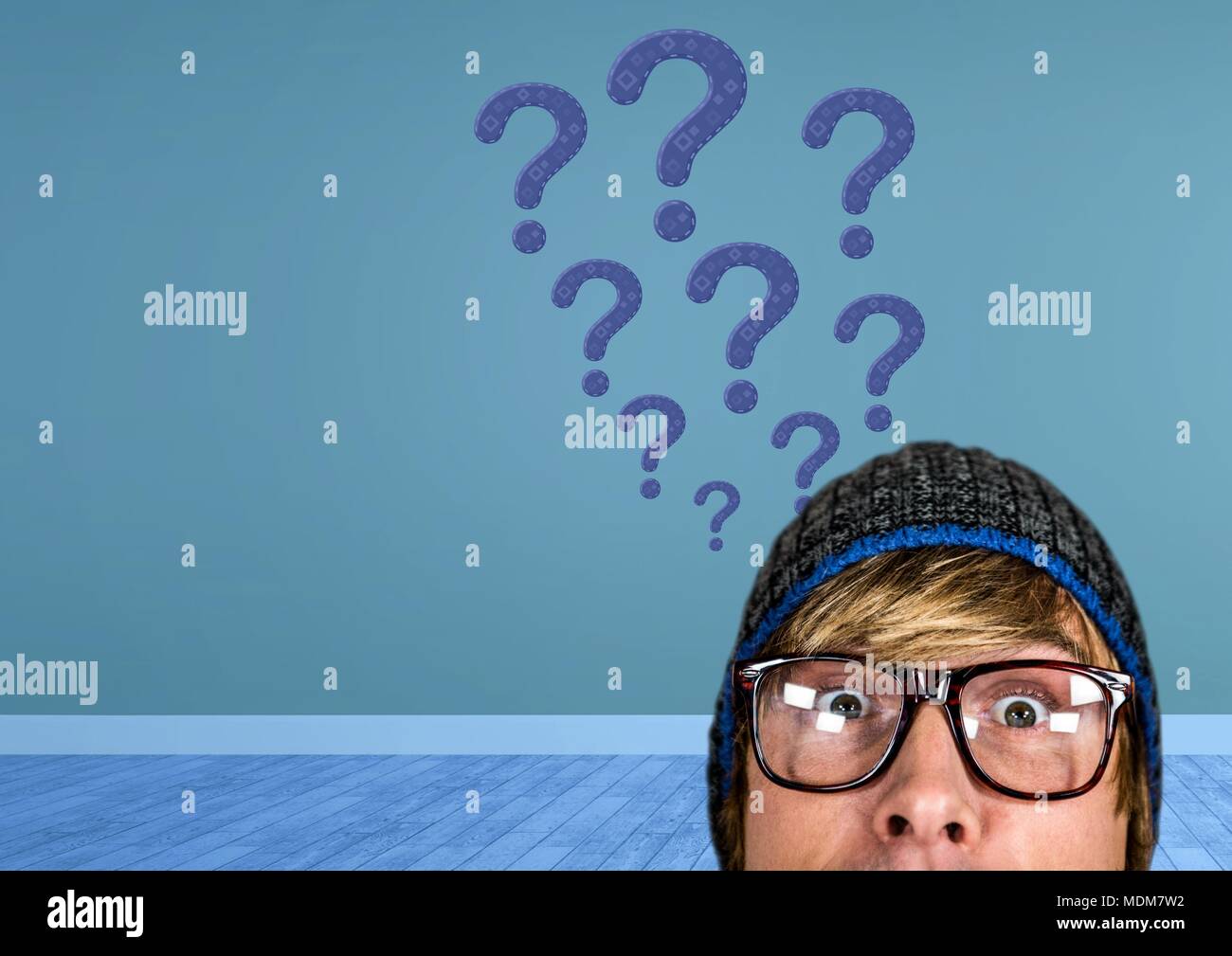 Man in hat thinking with blue stitched question marks Stock Photo - Alamy
