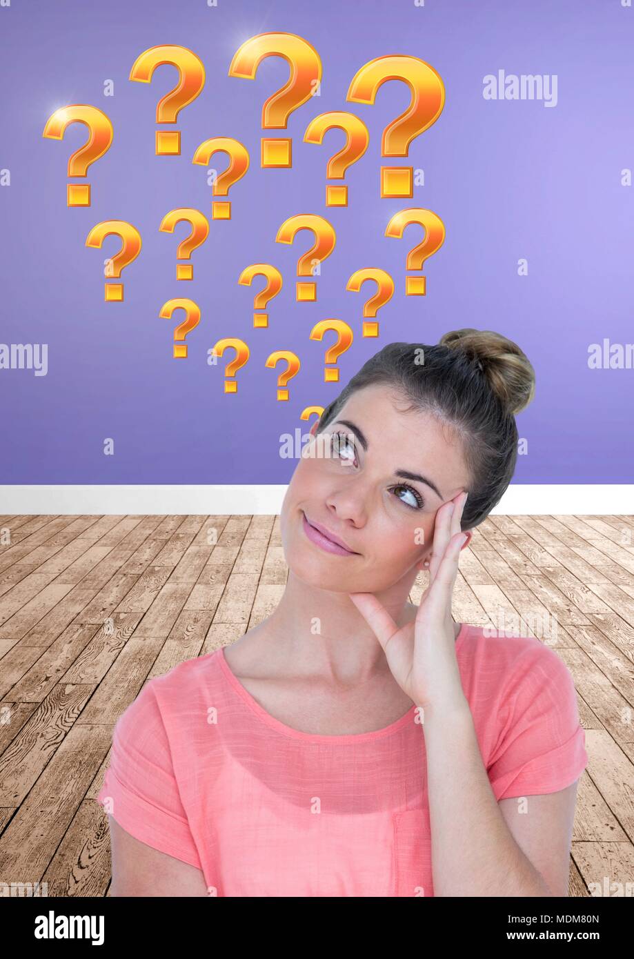 Woman thinking with gold question marks Stock Photo - Alamy