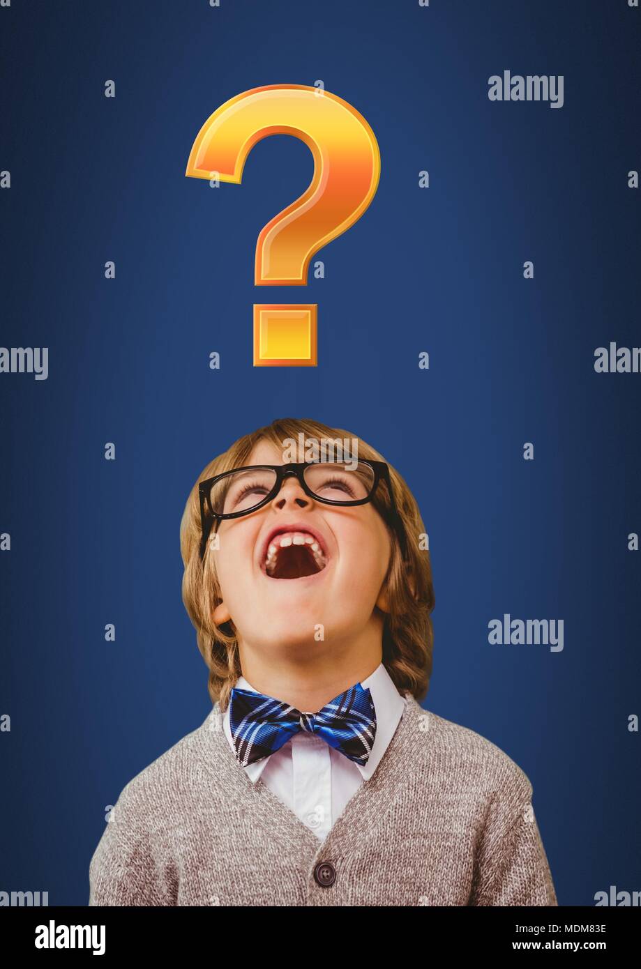 Quirky Kid Boy with gold question mark Stock Photo - Alamy