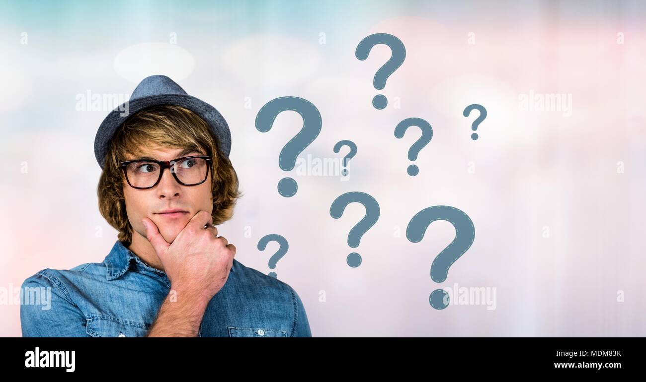 Man with hat thinking with blue question marks Stock Photo - Alamy