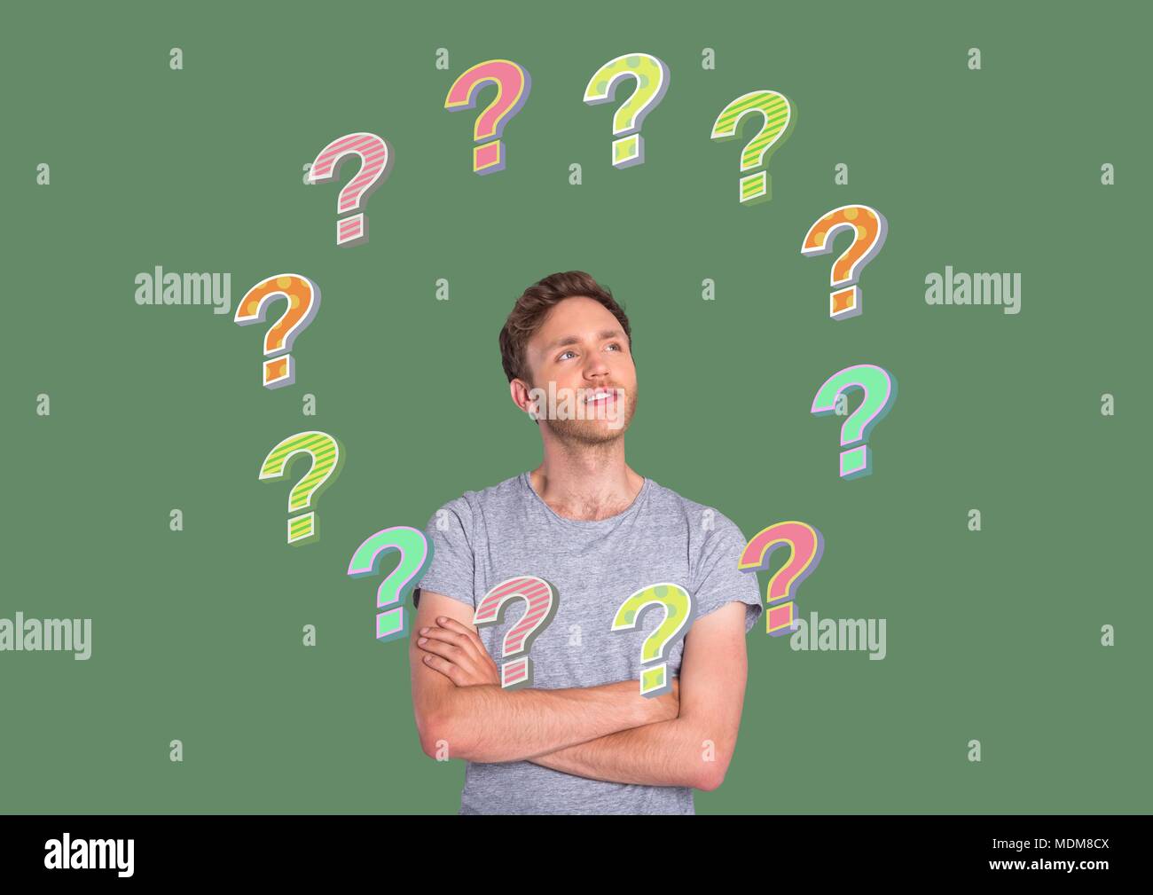 Man with colorful funky question marks in circle Stock Photo - Alamy