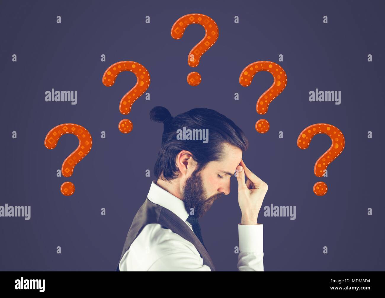 Man thinking with purple stitched question marks Stock Photo - Alamy