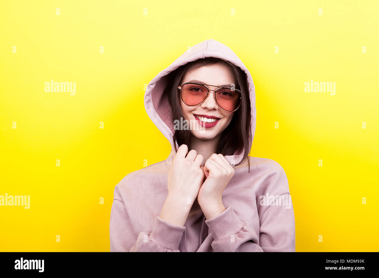 Cool young woman wearing a hood Stock Photo - Alamy
