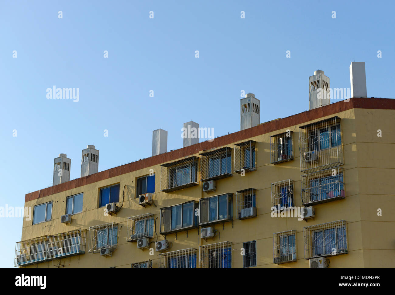 Metal-sheet chimneys atop an apartment building in Tongzhou, eastern ...
