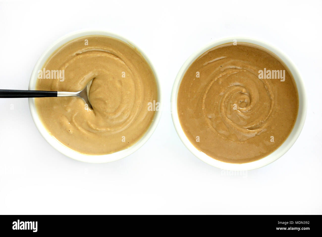 Tahini - two types : sesame and whole sesame Stock Photo - Alamy