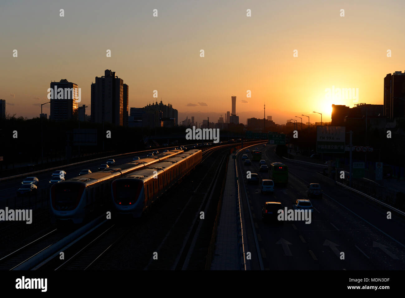 Trains pass on Beijing metro line 1 near Communications University ...