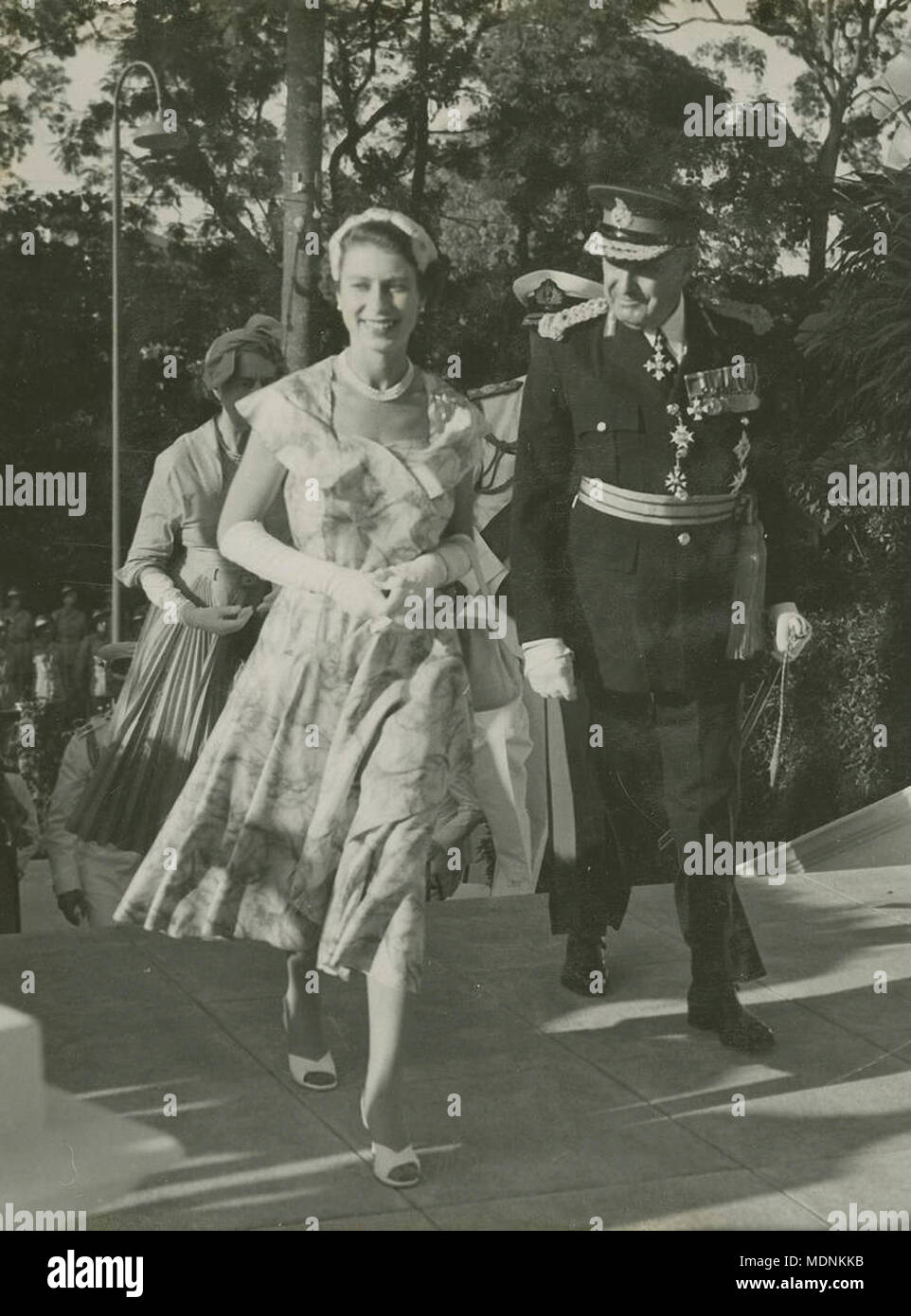 Queen Elizabeth II accompanied by the Governor, Sir John Lavarack Stock ...
